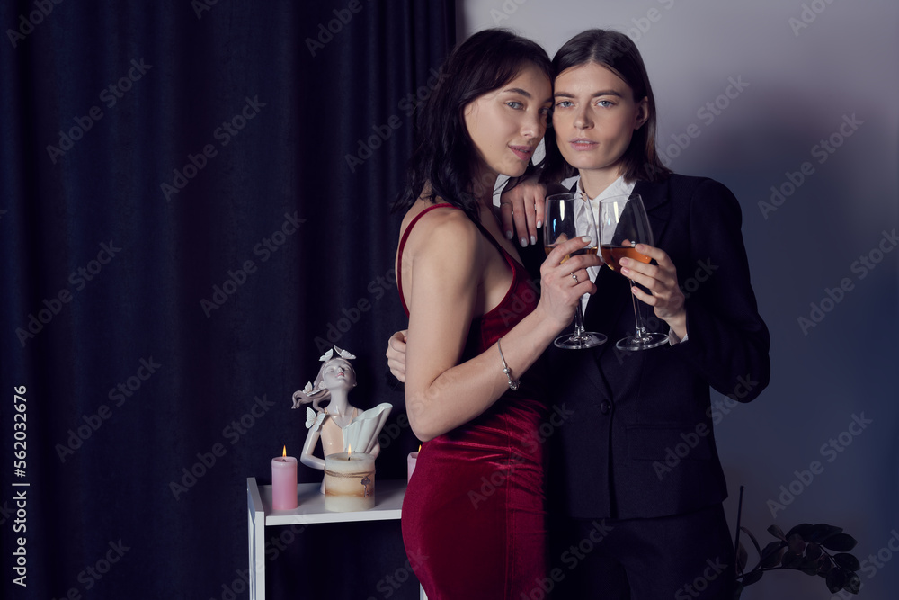 Cropped Close Up Shot Of A Two Lesbian Girls With Glasses Of White Wine