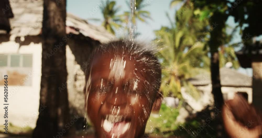 Portrait of an African Little Boy Jumping and Dancing Under Pouring ...