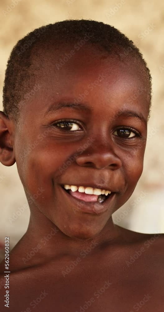 Close Up Portrait of a Playful Authentic African Kid Looking at the ...