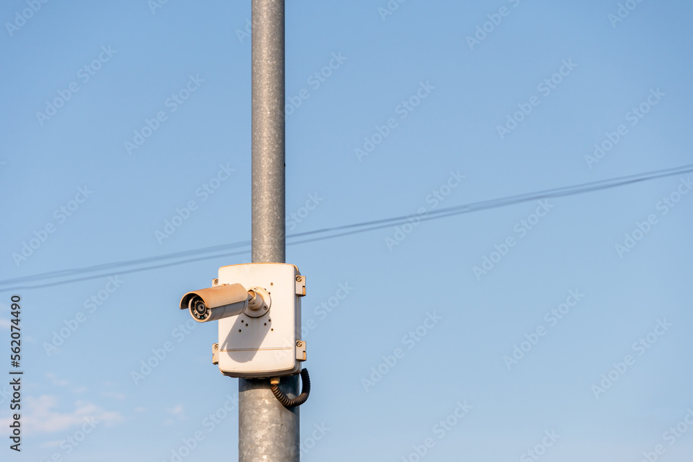 CCTV cameras at the railway station. Surveillance camera on a metal ...