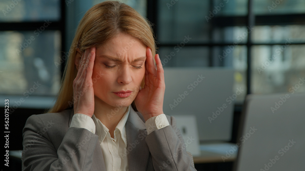 Caucasian middle-aged 40s adult woman office worker executive tired ...