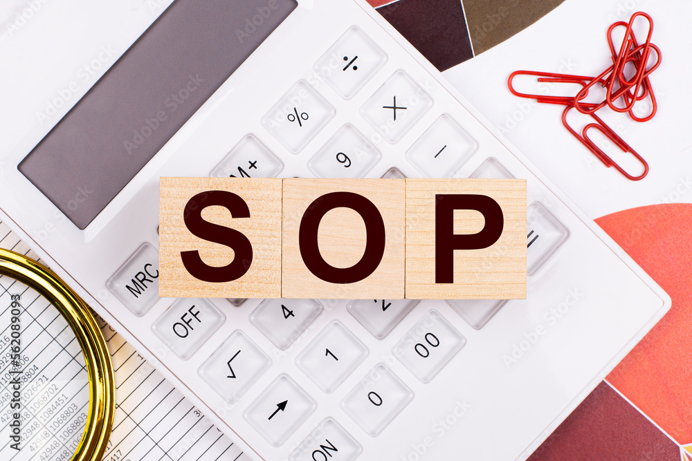 Flat lay, top view of office desk. Workplace with white calculator ...
