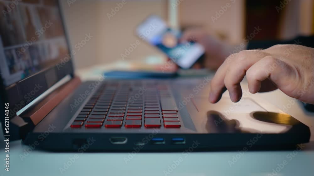 Male user hands typing on laptop keyboard sit at table, businessman ...