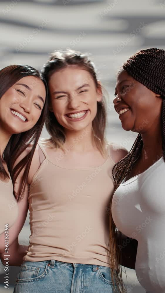Vertical video: Group of diverse girls feeling positive about body ...