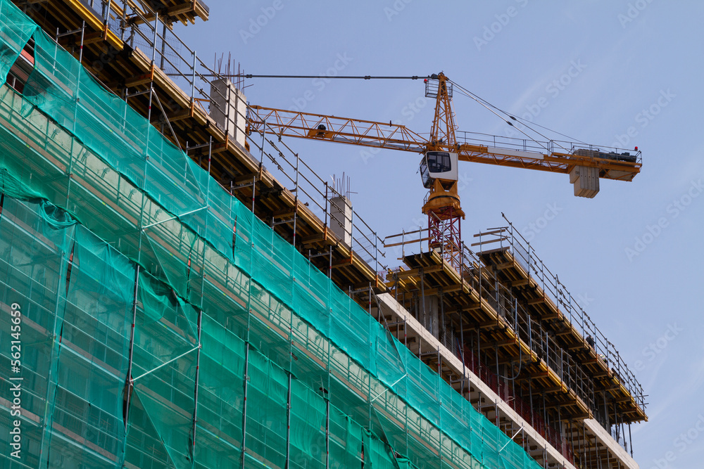 Crane at a construction site of residential or office building. Static ...