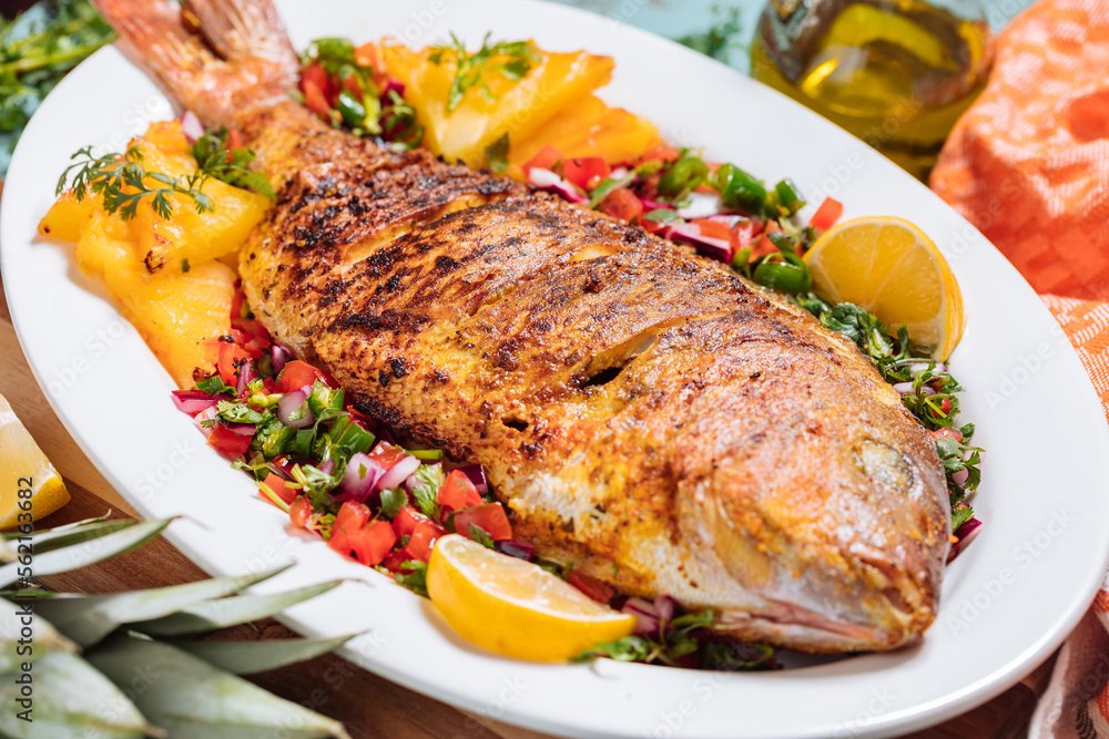 Red Snapper with ingredients. Prepared in tropical taste with Pico de ...