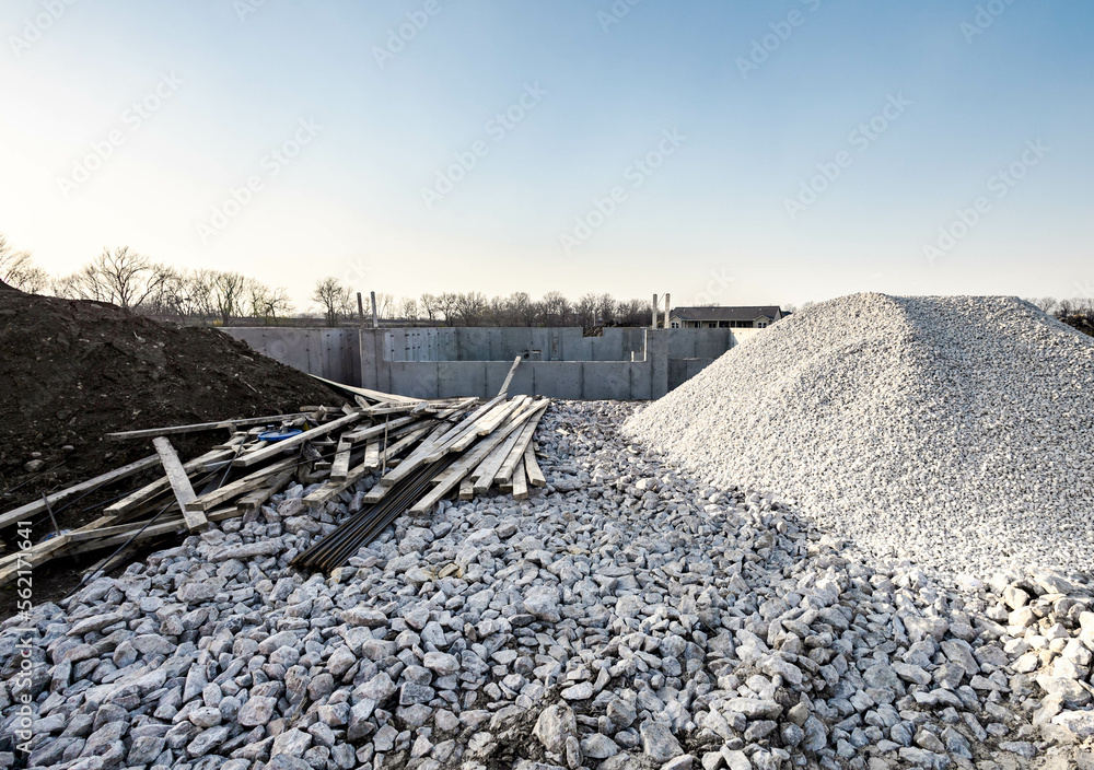 Heap of small and medium stone and crushed rock at a construction site ...