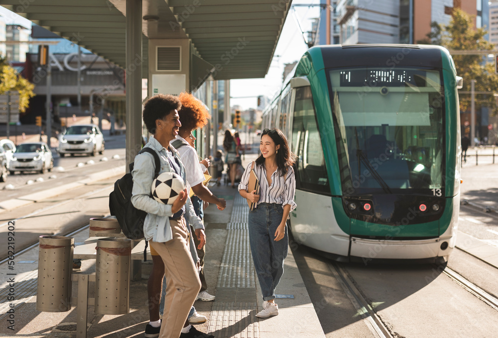 group of students at the train stop to go to university. concept of ...