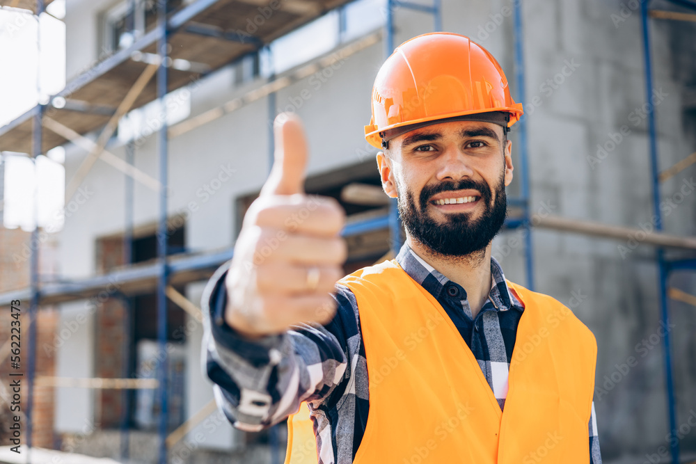 Foreman working ob building object showing thumbs up sign Stock Photo ...