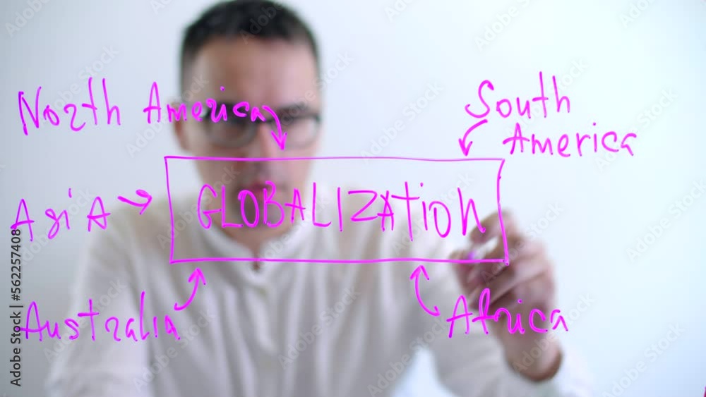 Guy in a white shirt writes the text on a glass board. Office worker ...