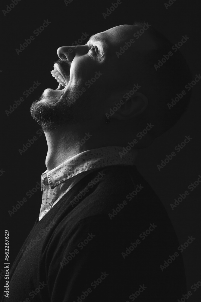 Demonic laughter concept. Portrait of charismatic 40-year-old man ...