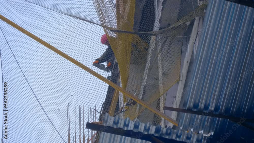 Construction site, where a modern beautiful multi-storey building is ...