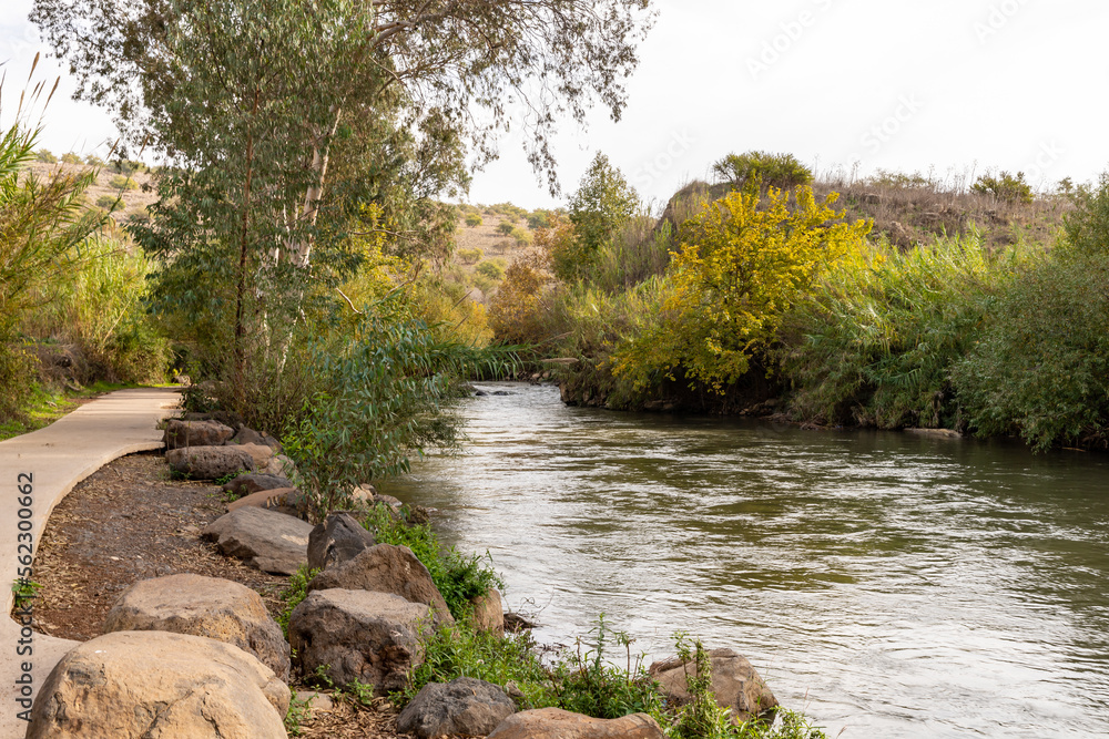 The Jordan River flows near the ruins of the fortress wall of the ...