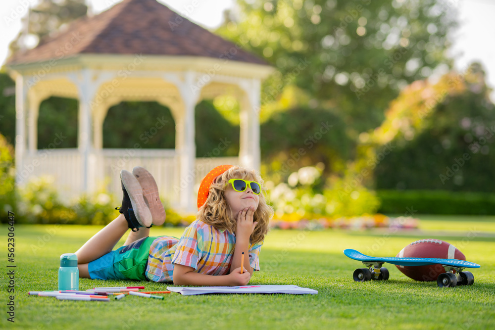 Outdoor kid play and draw craft artwork homework. Kid boy create artist ...