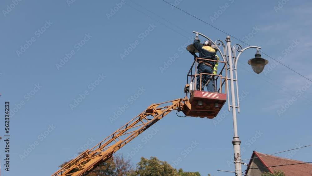 light bulb, pole lamp, equipment installs. Street light repair work ...
