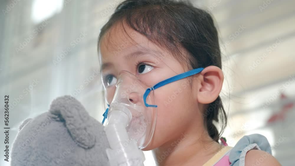 Kid girl making makes inhalation nebulizer steam sick cough at home ...