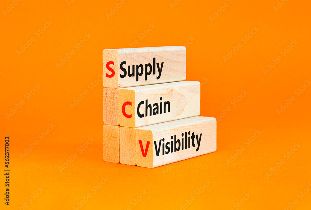 SCV supply chain visibility symbol. Concept words SCV supply chain visibility on wooden blocks ...