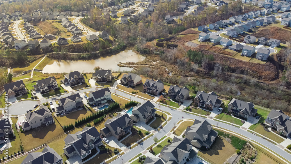 Aerial view urban sprawl and master planning subdivision with row of ...