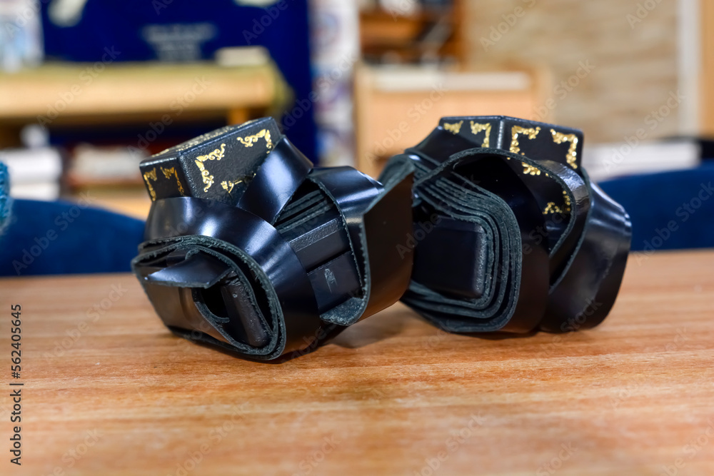 tefillin. A set of tefillin with verses from Torah written on them and ...
