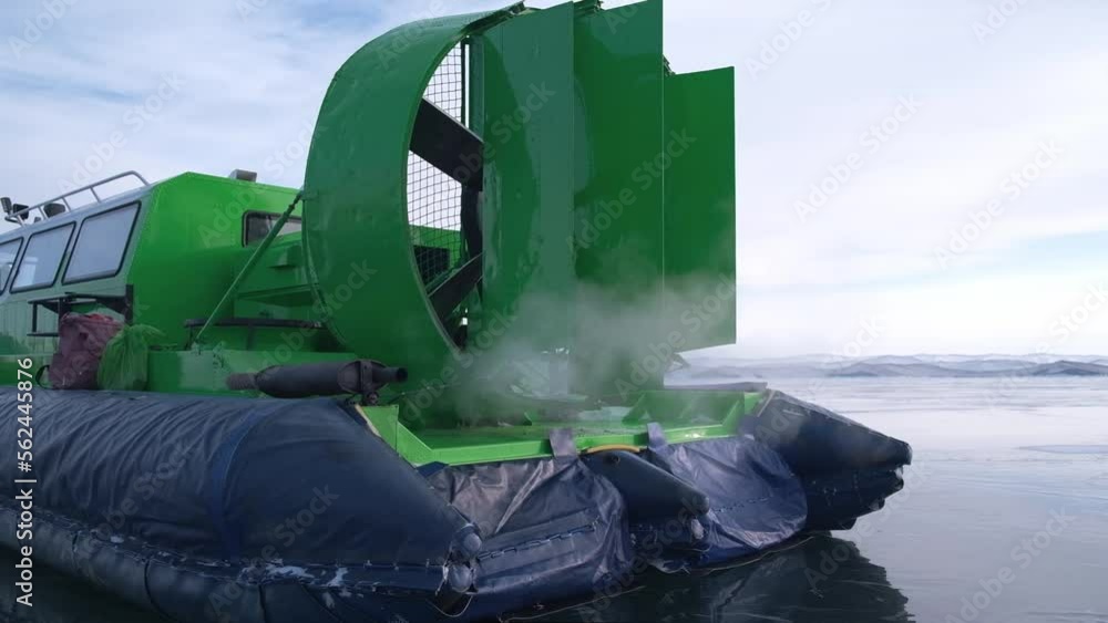 hovercraft with a running engine stands on the ice of Lake Baikal in ...