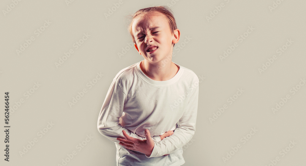 Stomach pain. Teen boy with stomachache. Child having terrible pain in ...