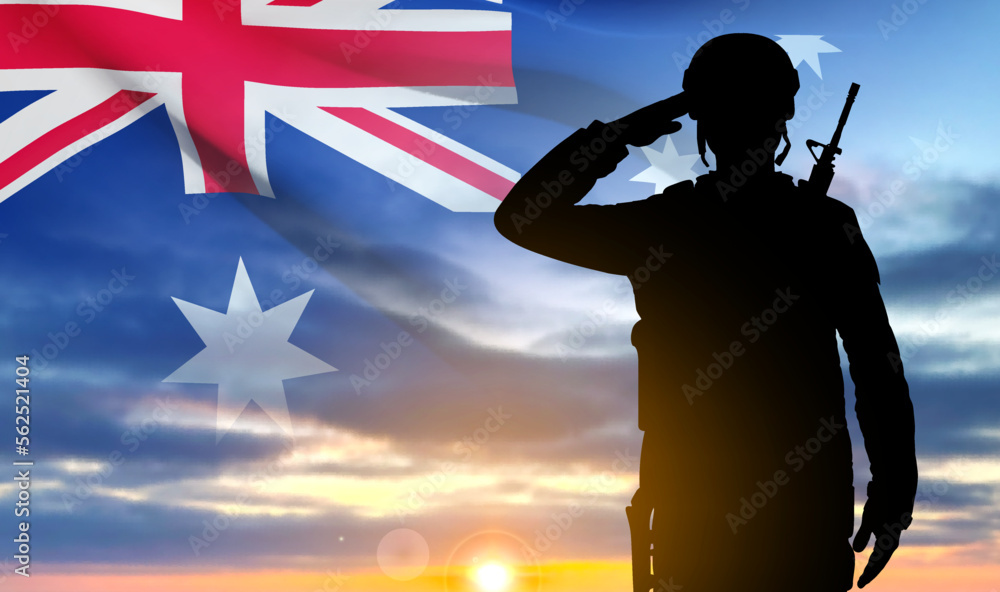 Silhouette of Saluting Soldier with Australian flag on background of ...