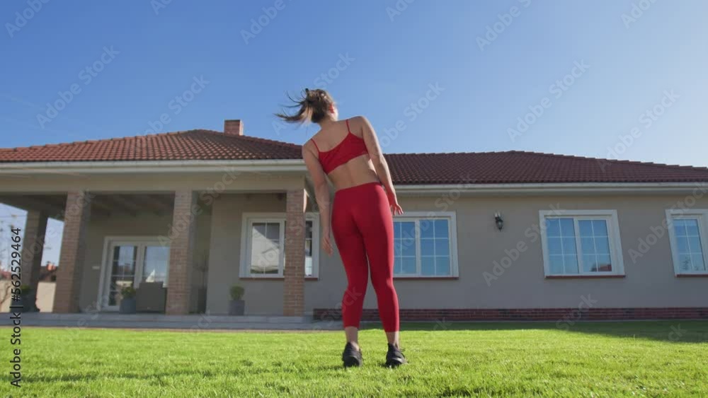 Athlete performs gymnastics movement, turning her body toward the ...