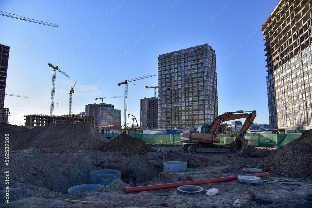 Excavator on Sewer pipes laying. Sanitary drainage, external sewage ...