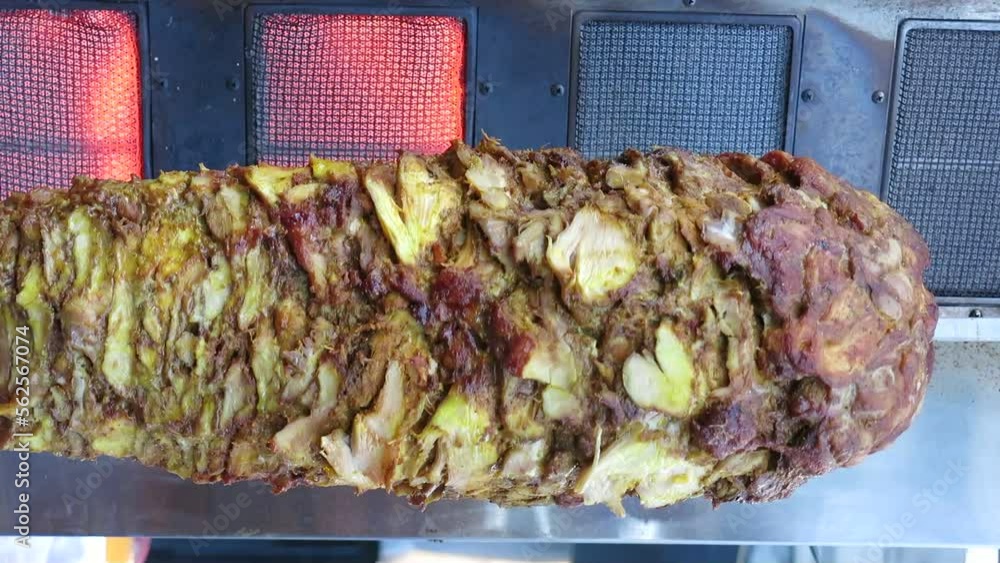 Grilled skewered meat (chicken or beef) on rotating spit. A traditional ...