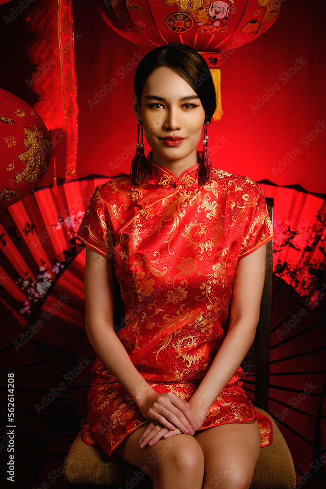 asian woman in tradional chinese red costume with background of chinese ...