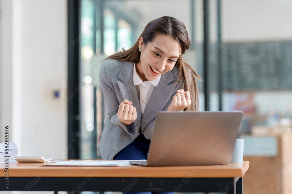 Attractive Asian woman happy at plan success with happy smile on ...