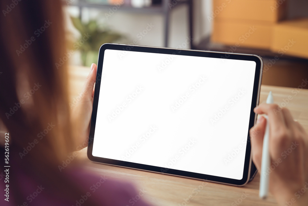 Hand holding digital pen and using tablet mockup of blank screen. Take ...