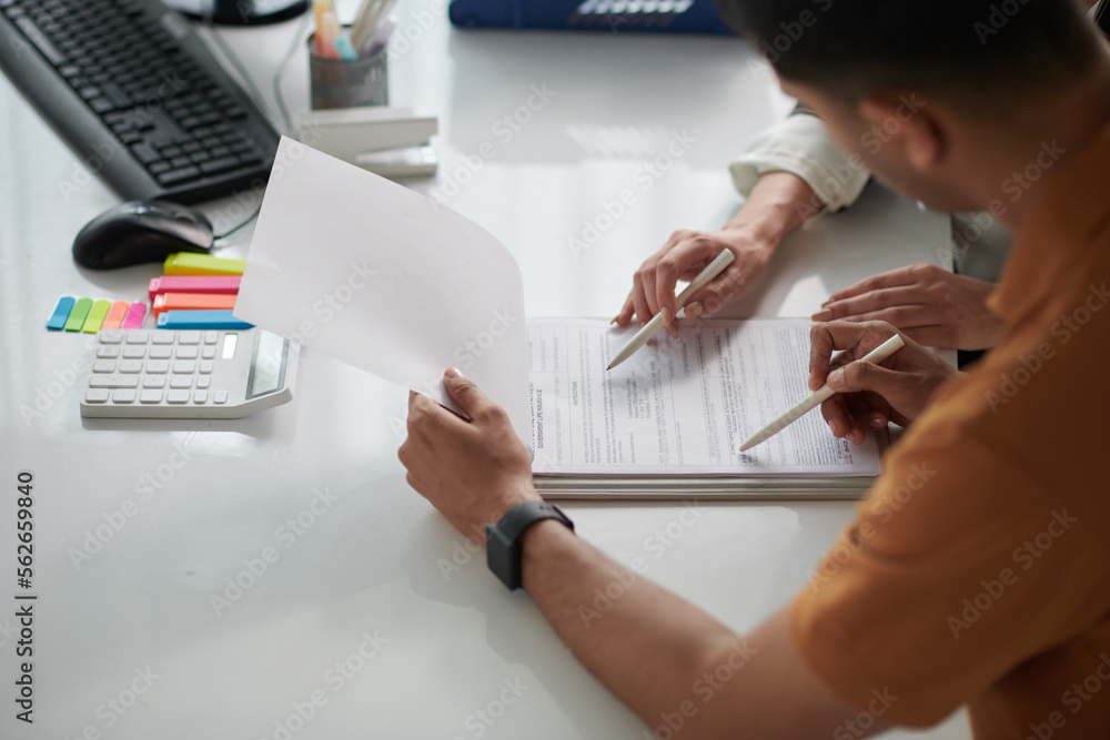 Insurance agent and client reading payment agreement together Stock ...