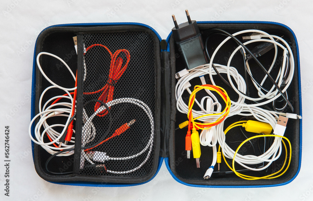 Chaotic mixed cables, wire nodes in a black box. Yellow, orange, white ...