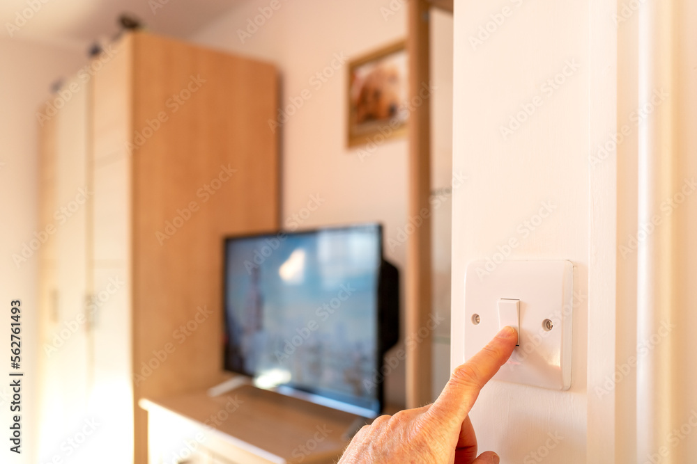 Homeowner seen switching off a bedroom light in a modern private ...