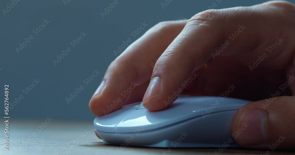 Close up hand of office worker actively using a computer mouse while ...