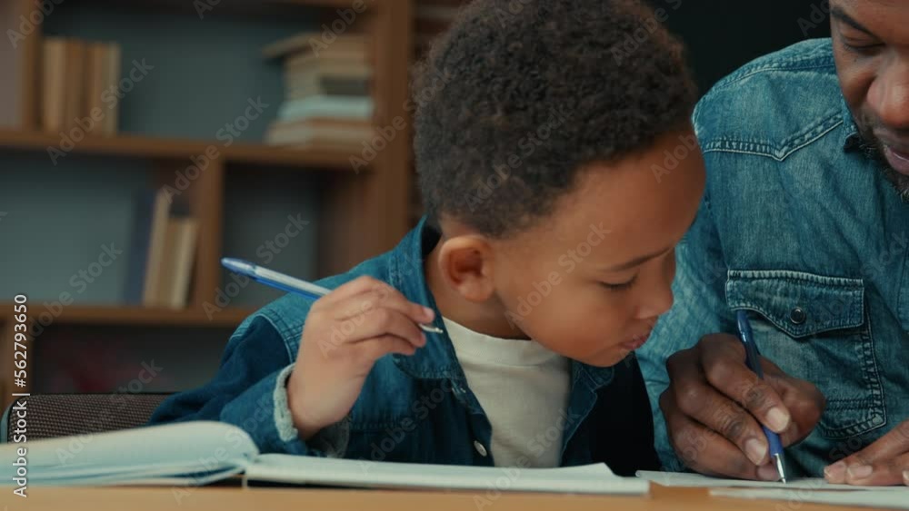 Video Stock African American child boy with ethnic father learning at ...