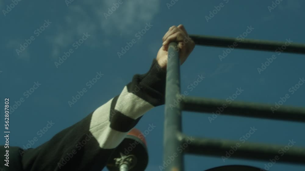 a hand grabs a railing Stock Video | Adobe Stock