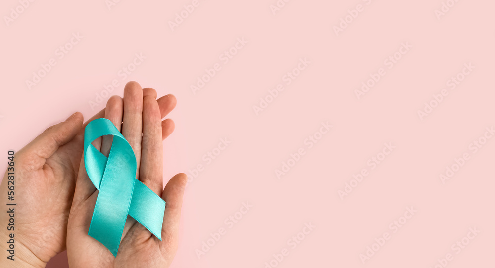 Woman holding Teal ribbon. Symbolic for cervical cancer, ovarian cancer ...
