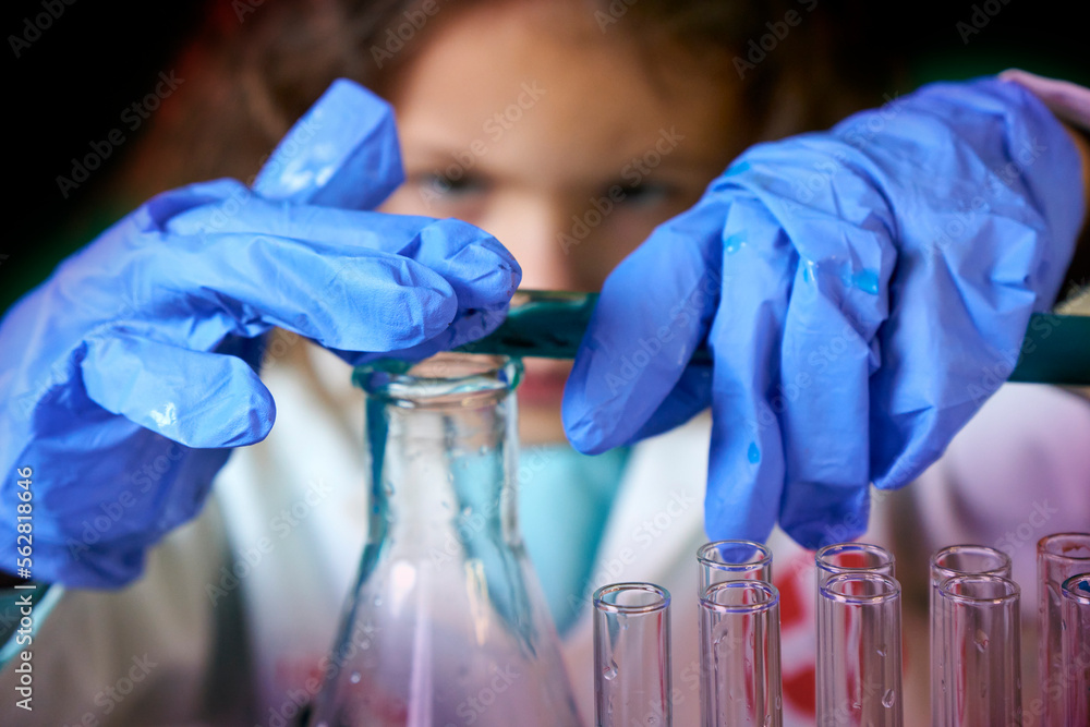 Little kid doing experiments with blue liquid. Cute child wants to ...