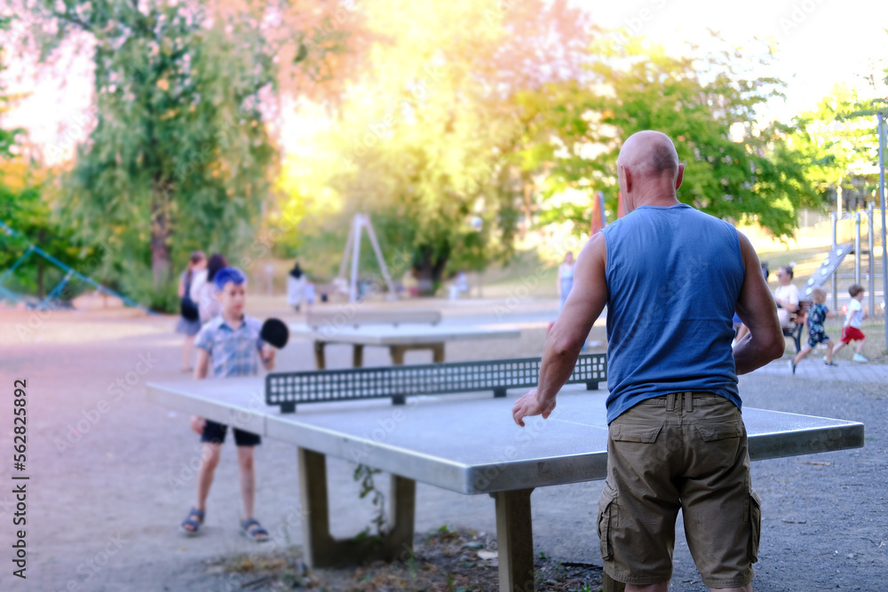 mature charismatic sports man, senior 60 years and his rival, child ...