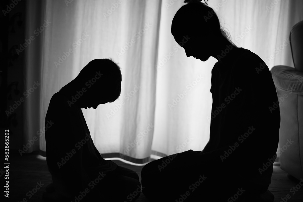 Sad mother and child silhouette indoors Stock Photo | Adobe Stock