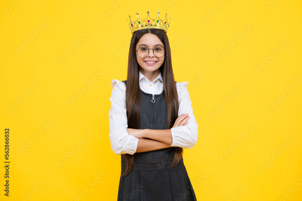 Little queen wearing golden crown. Teenage girl princess holding crown ...