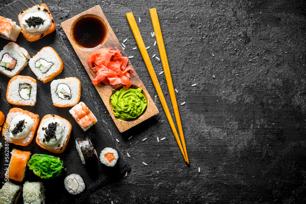 The range of different types of sushi, rolls and Maki with sauces and ...