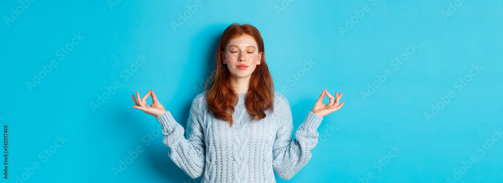 Smiling confident girl with red hair staying patient, holding hands in ...
