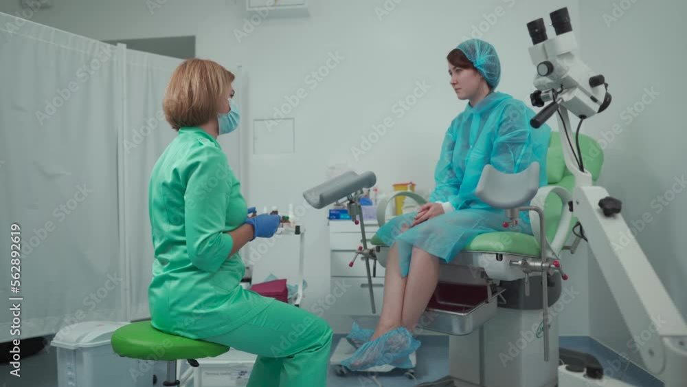 Patient sitting in a gynecological chair during a consultation with her ...