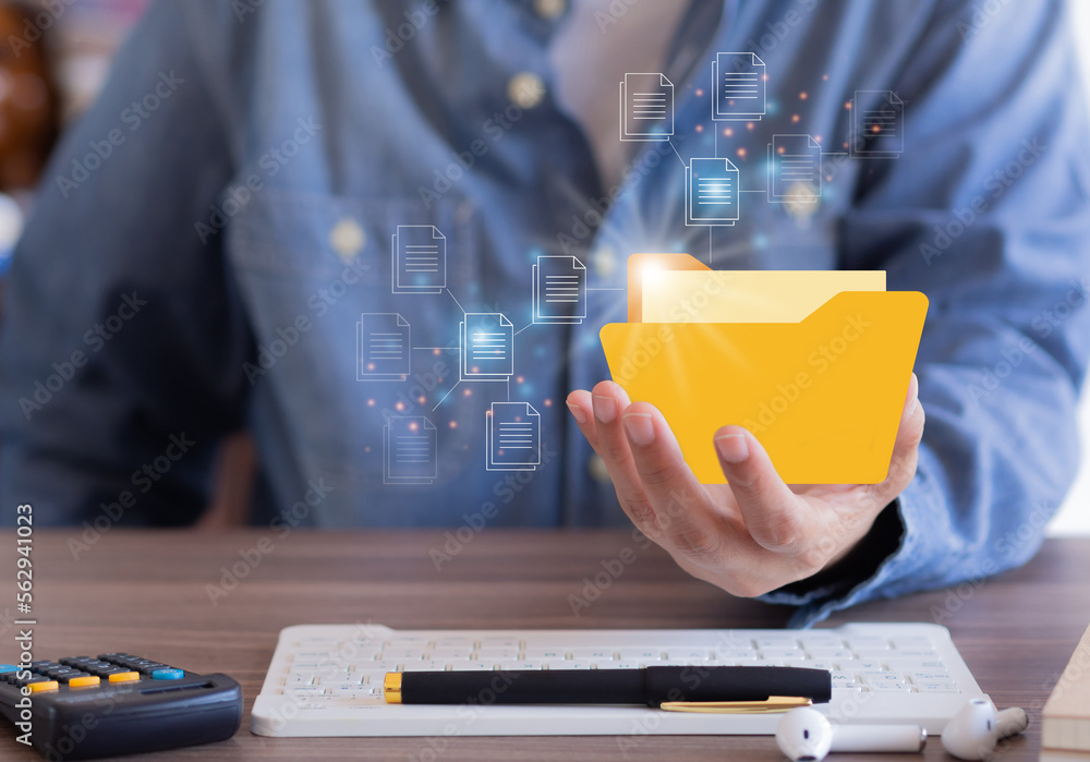 Document management system concept. Hand-holding folder the virtual ...