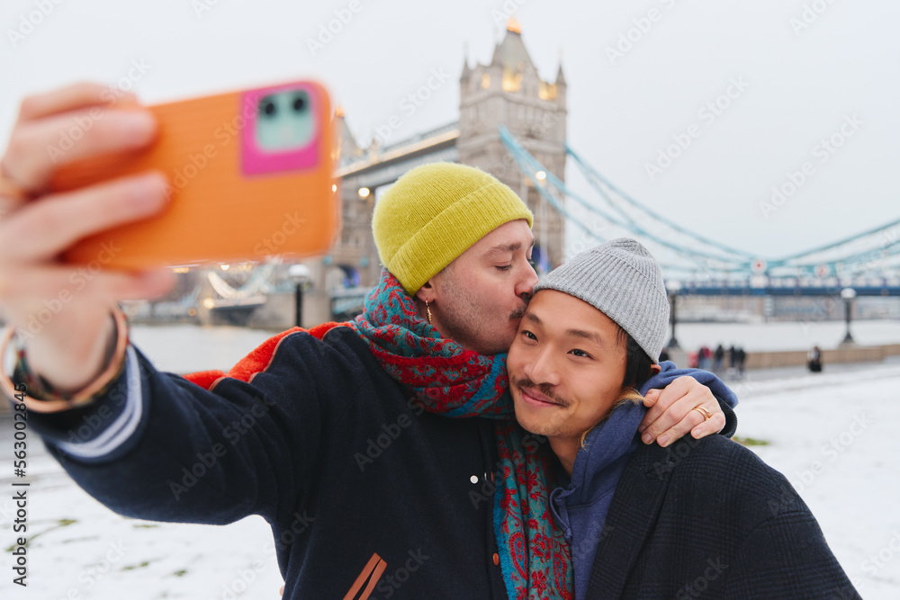 Young Happy Asian And Caucasian Same Sex Interracial Couple Kissing And