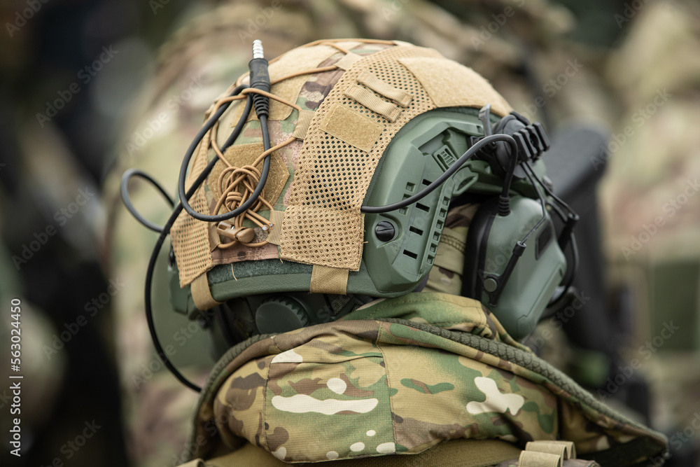Army soldier with a machine gun in his hand. Soldier, commando standing ...