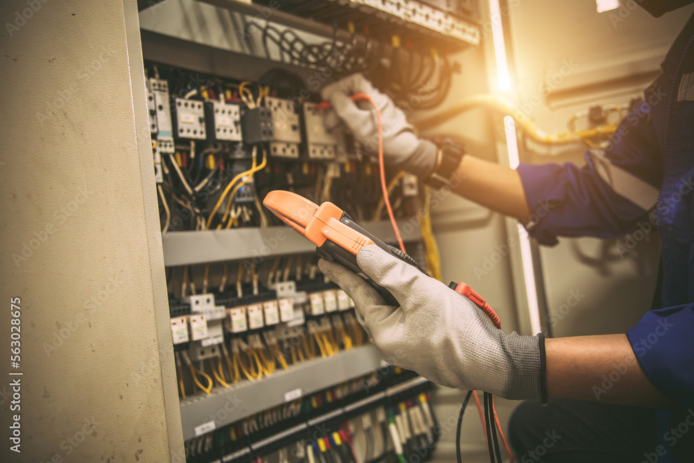 Electricity or electrical maintenance service, Electrician hand holding ...